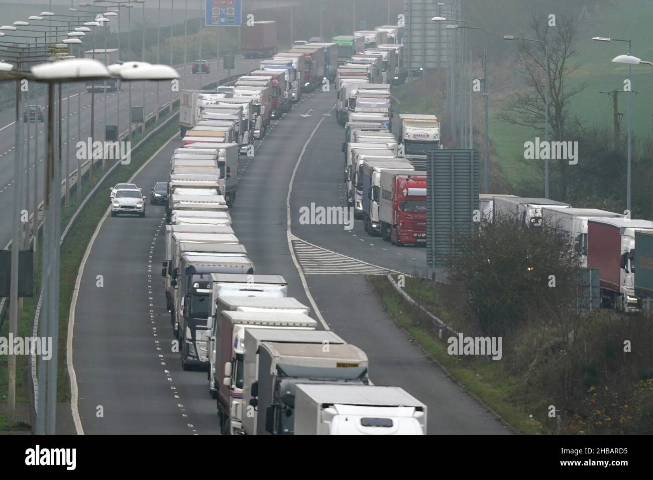 Freight lorries queuing on the M20 motorway in Kent heading to Dover ...