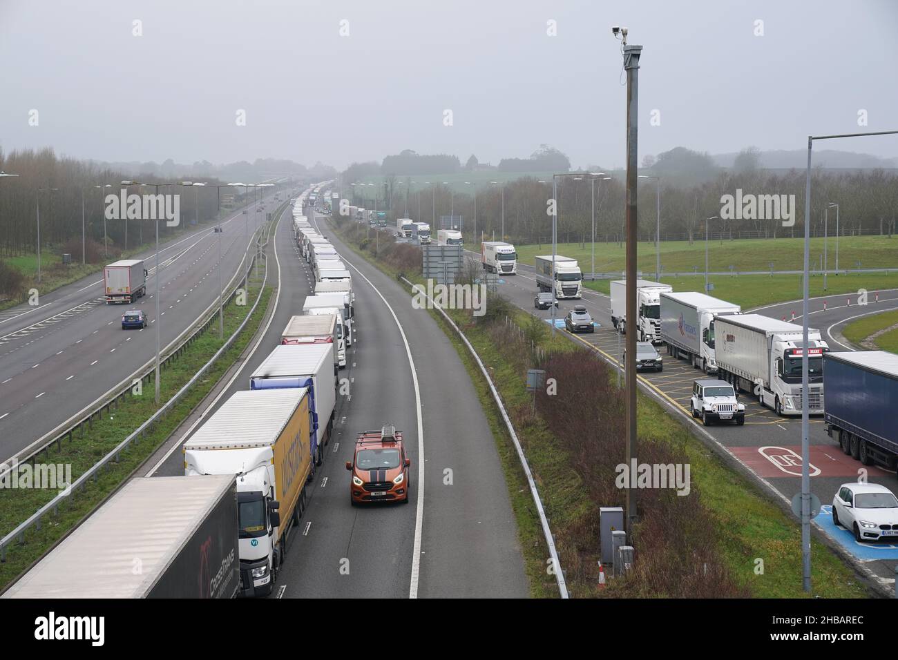 Freight lorries queuing on the M20 motorway in Kent heading to Dover ...