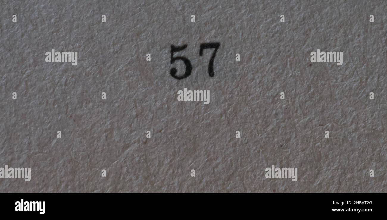 The number 57 printed on a piece of paper. Paper texture Stock Photo ...
