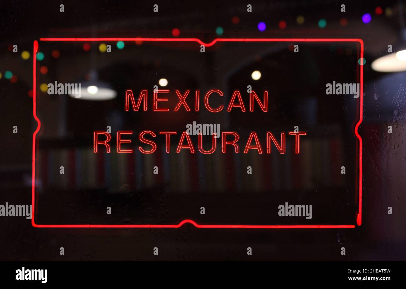 Vintage Neon Mexican Restaurant Sign in Rainy Window Stock Photo - Alamy