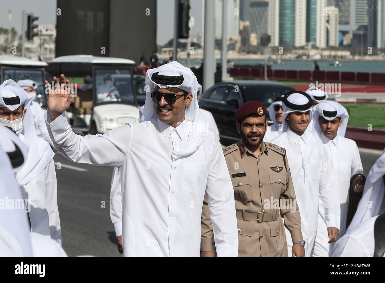 Doha, Qatar. 18th Dec, 2021. Tamim bin Hamad Al Thani (M), Emir of ...