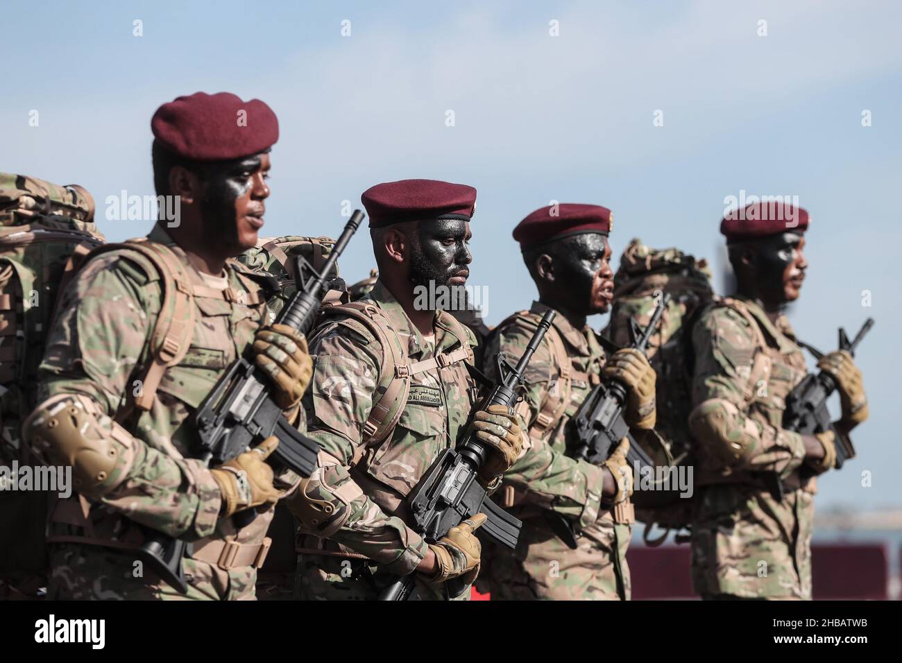 Doha, Qatar. 18th Dec, 2021. Armed soldiers in uniform march on a ...