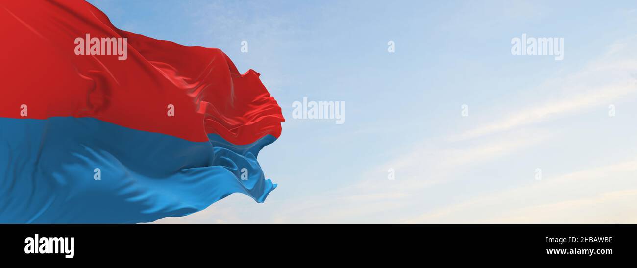 flag of Canton of Tessin , Switzerland at cloudy sky background on ...