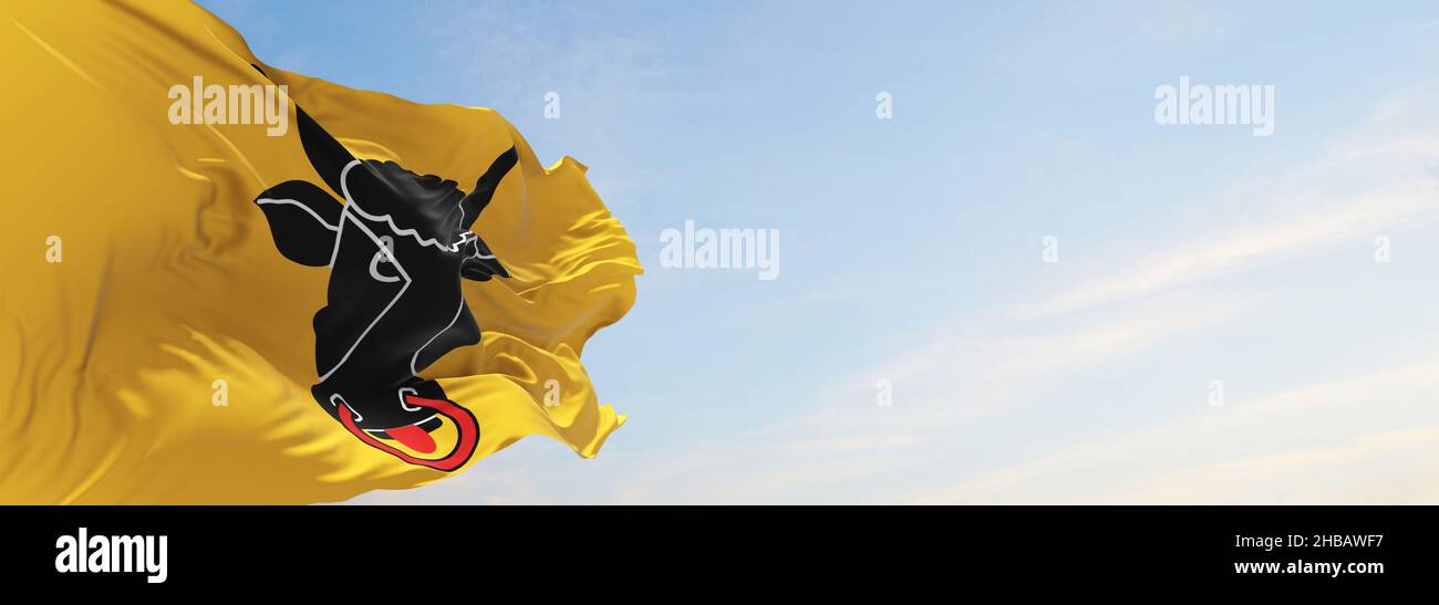 flag of Canton of Uri , Switzerland at cloudy sky background on sunset ...