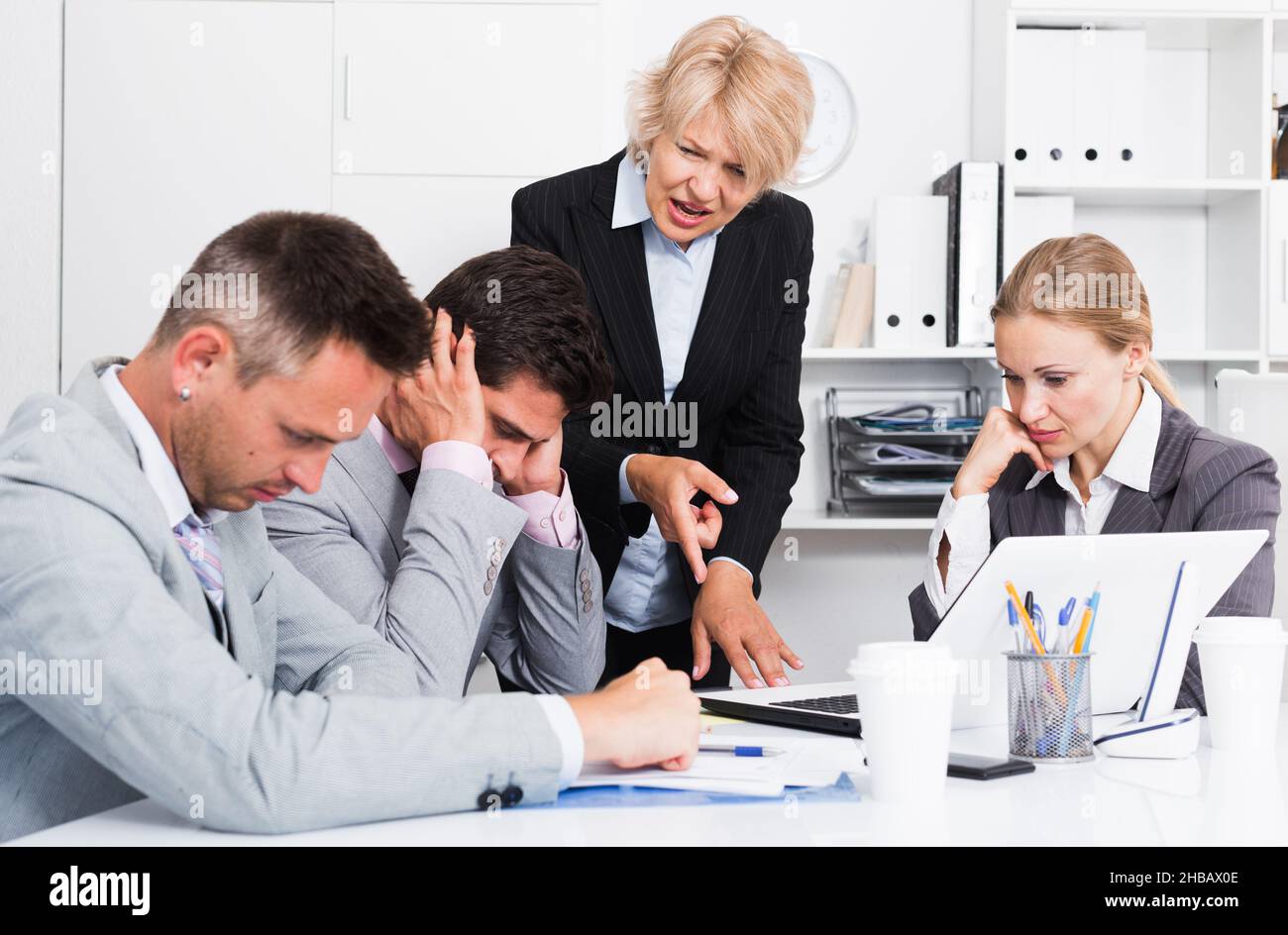 Female manager expressing dissatisfaction with teamwork Stock Photo - Alamy