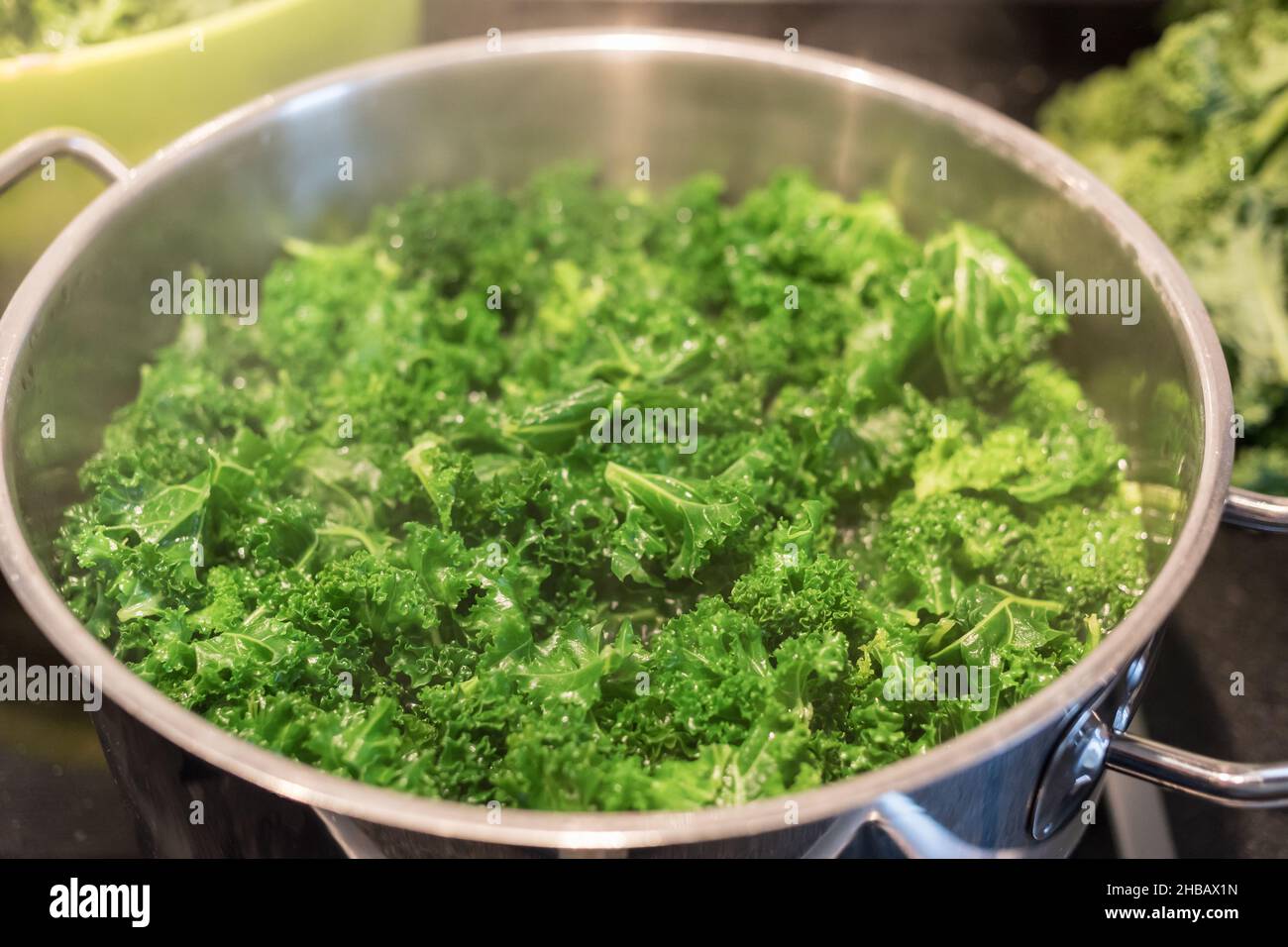 fresh kale in the cooking pot Stock Photo - Alamy