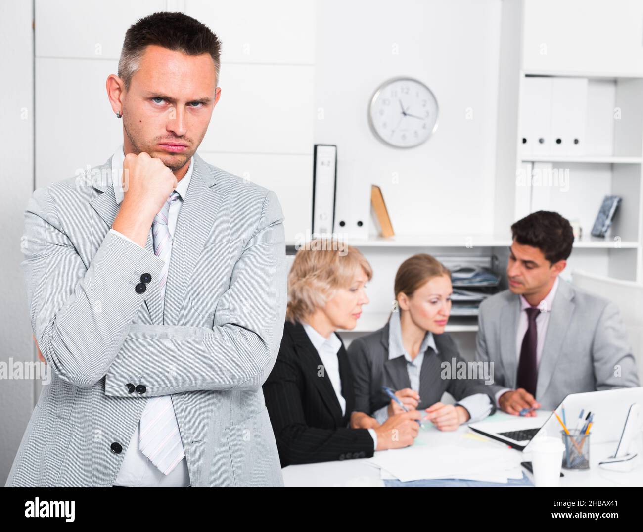 Businessman feeling angry to coworkers Stock Photo - Alamy