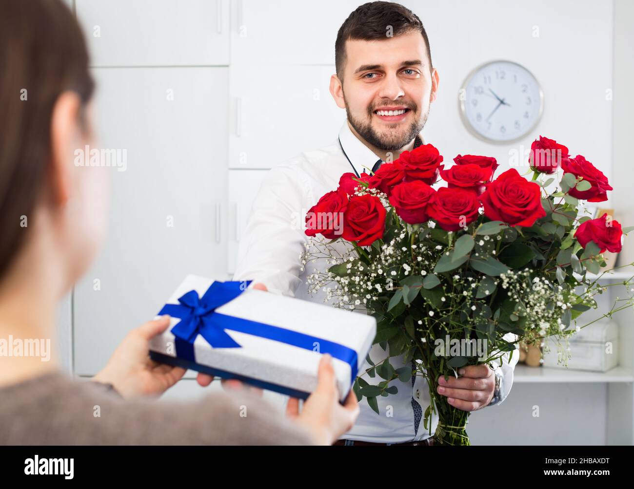 Romantic young man presenting flowers hi-res stock photography and ...