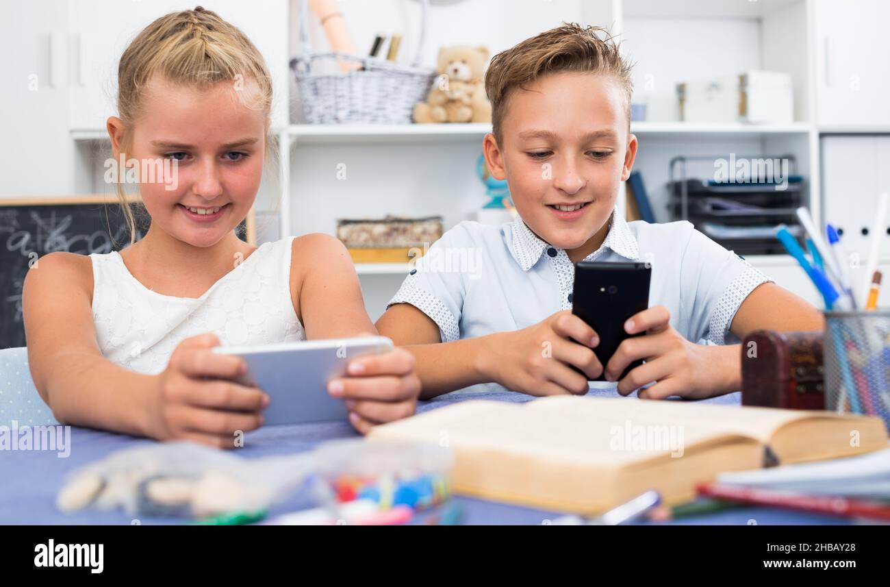 Children are playing in smartphones Stock Photo - Alamy