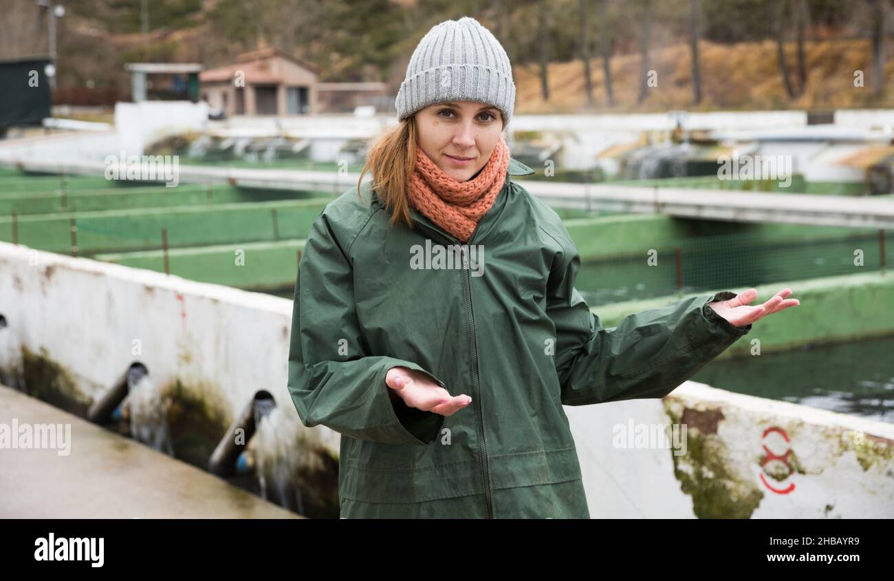 Female showing fish tanks on sturgeon farm Stock Photo - Alamy
