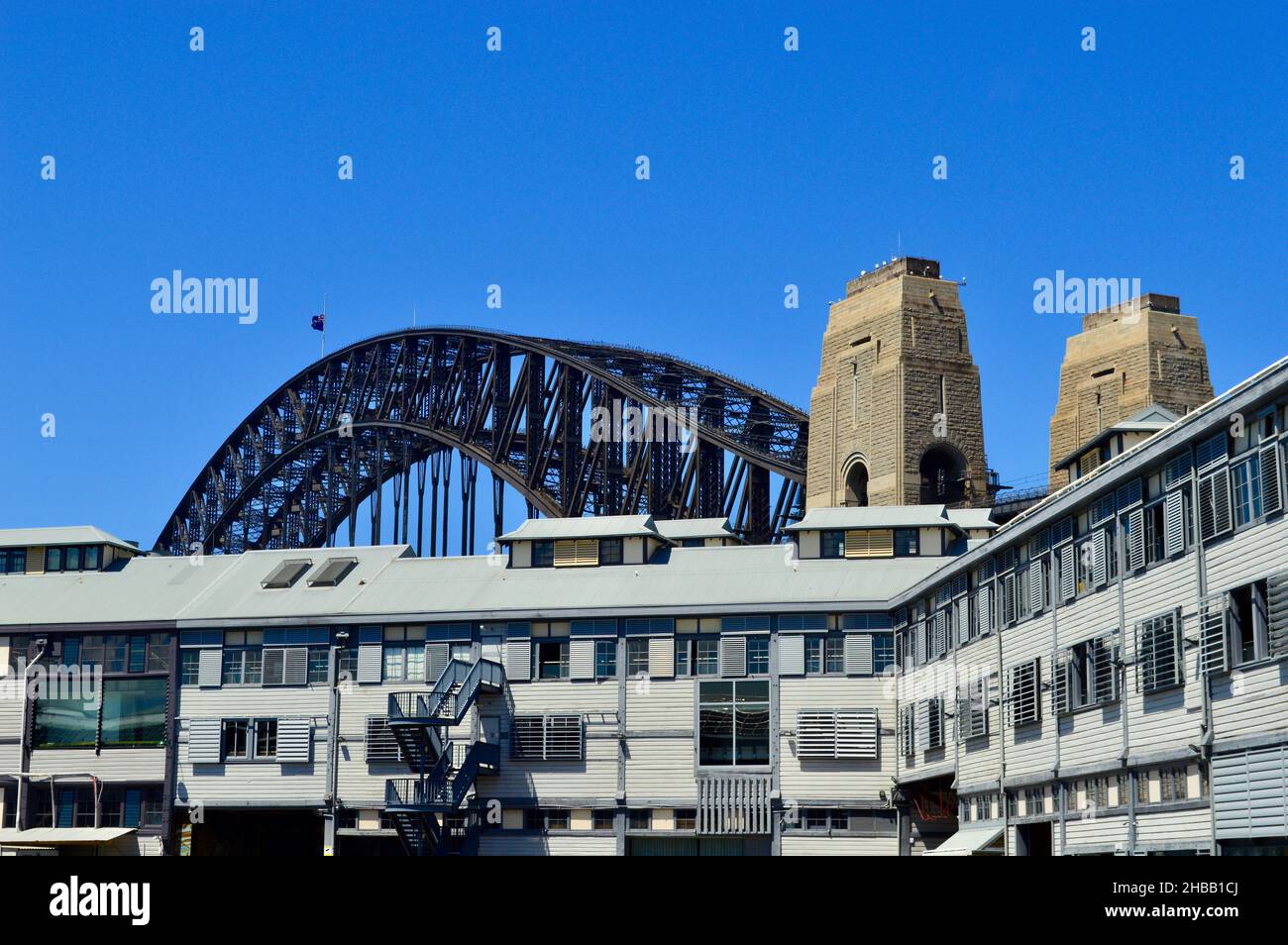A view of the dock lands at Walsh Bay with the Sydney Harbor Bridge in ...