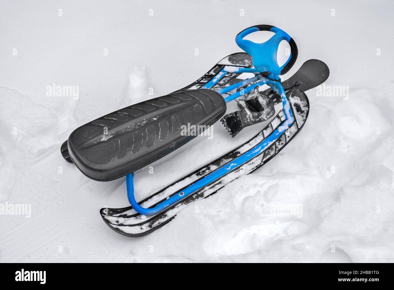 Red sledge in the snow hi-res stock photography and images - Alamy