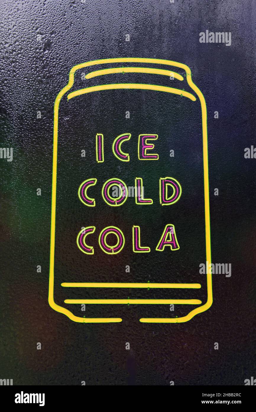 Neon Ice Cold Cola Sign in Rainy Wet Window Stock Photo - Alamy