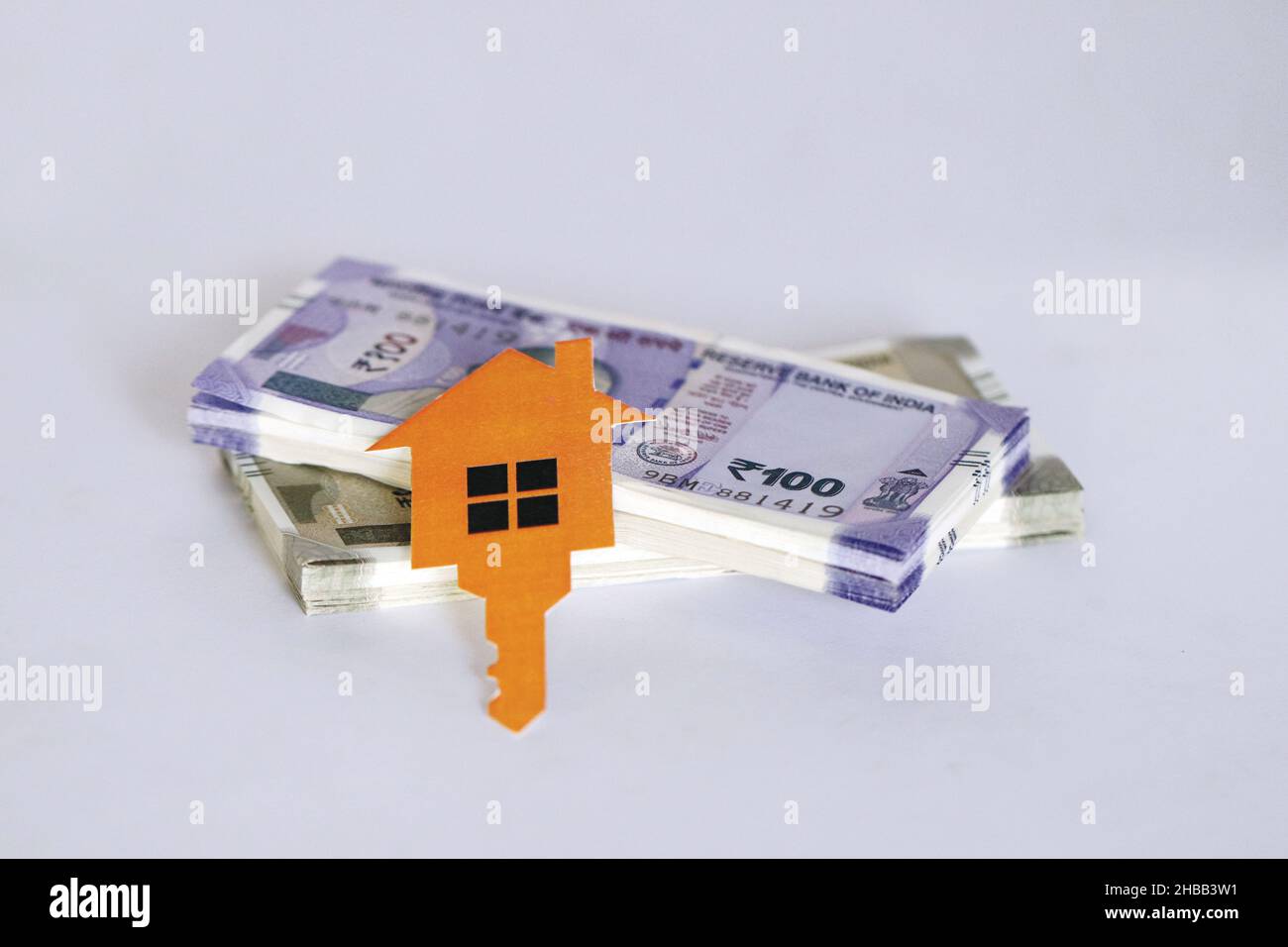 Stack of One hundred and five hundred Indian rupees fresh notes in ...