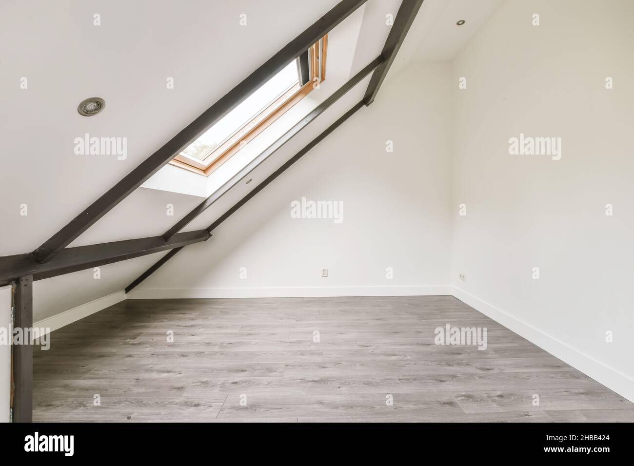 Amazing attic room design with windows and parquet flooring Stock Photo ...