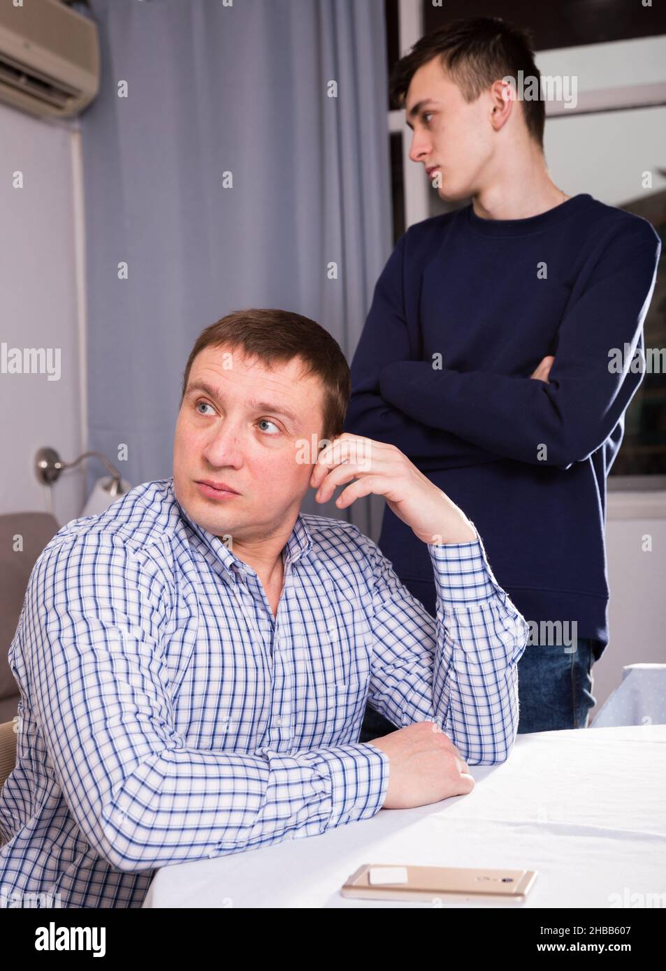 Adult son is not wanting talk with his father in time conflict Stock ...