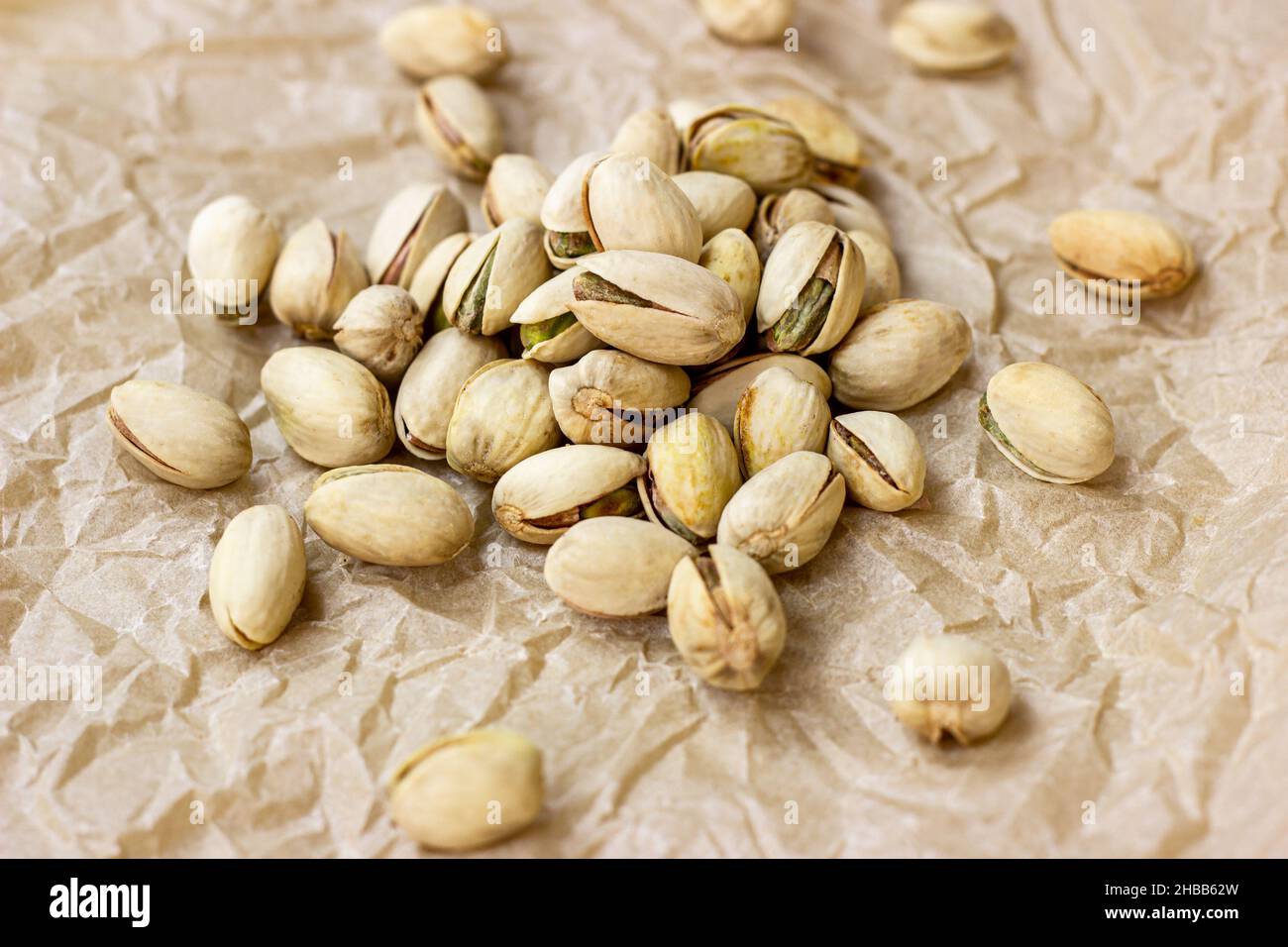 Roasted salted pistachio nuts in nutshell on light background Stock Photo - Alamy