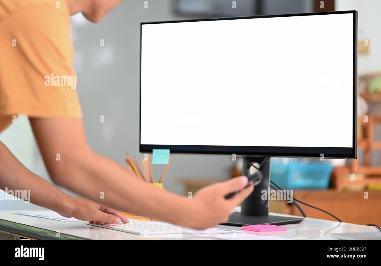 Programmer using mockup blank screen computer on a programming desk Stock Photo - Alamy