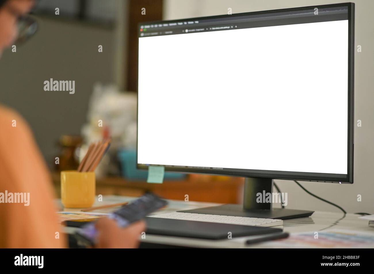 Programmer and mockup blank screen computer on a programming desk Stock ...