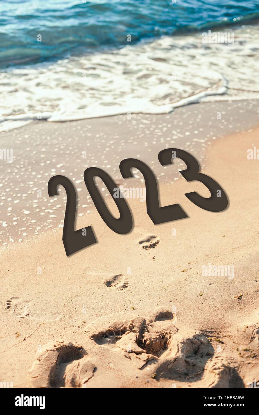 2023 years written on sandy tropical beach sea Stock Photo - Alamy