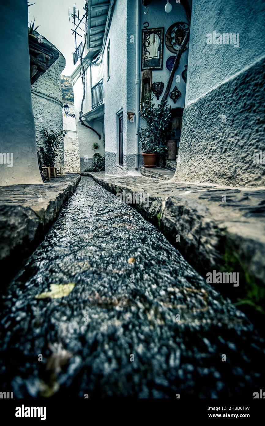 Narrow stream of water between buildings Stock Photo - Alamy