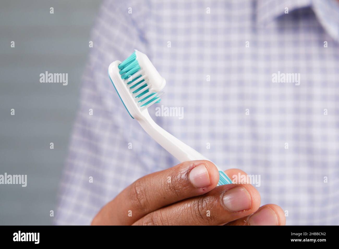 hand holding tooth brush with paste Stock Photo - Alamy