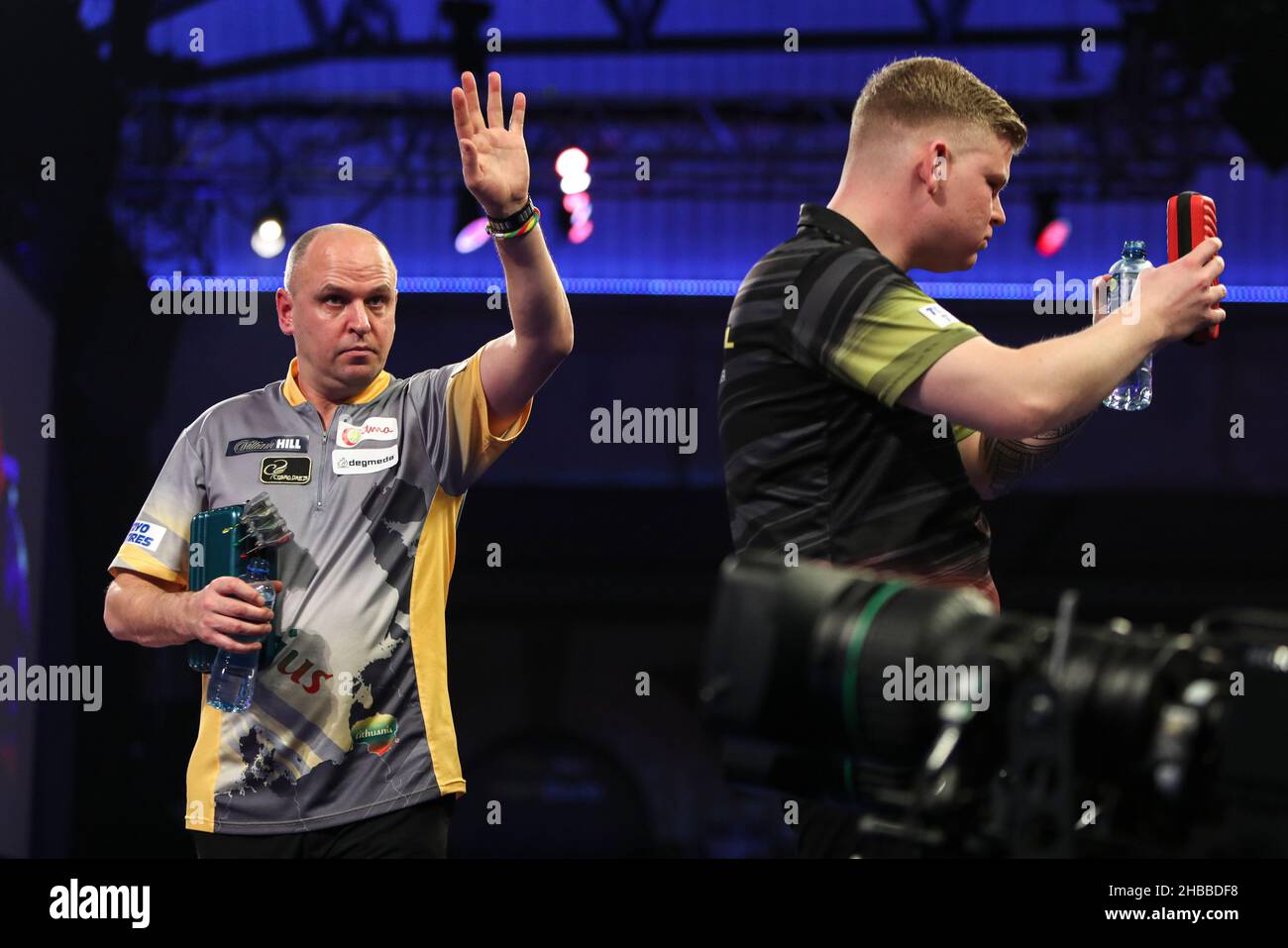 Darius Labanauskas (left) waves to the crowd after losing his match ...