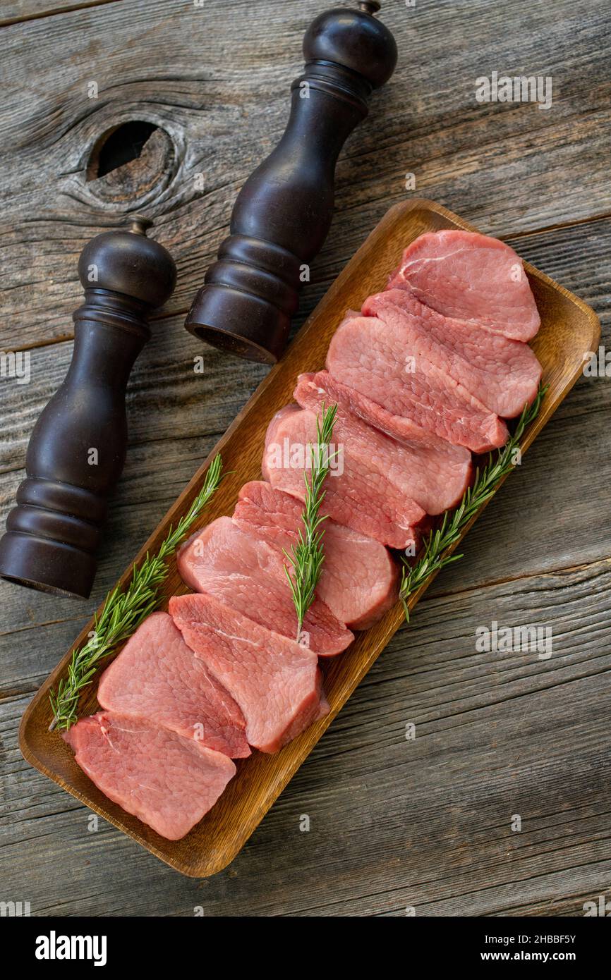 Raw roast beef on wooden background. Close-up roast beef. Top view ...