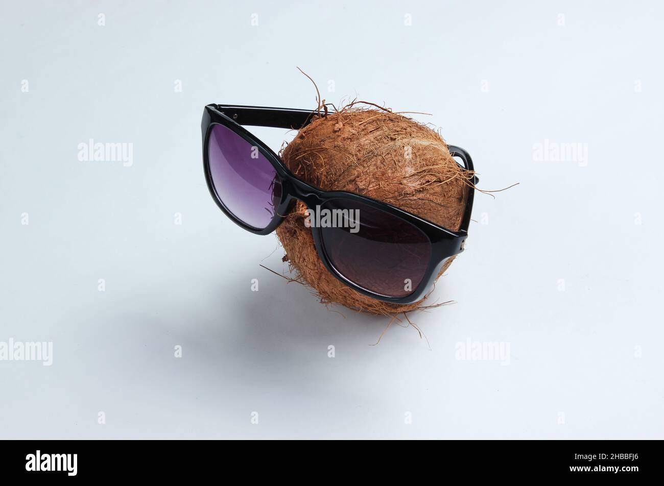 Creative fashion concept. Coconut with sunglasses on white background ...