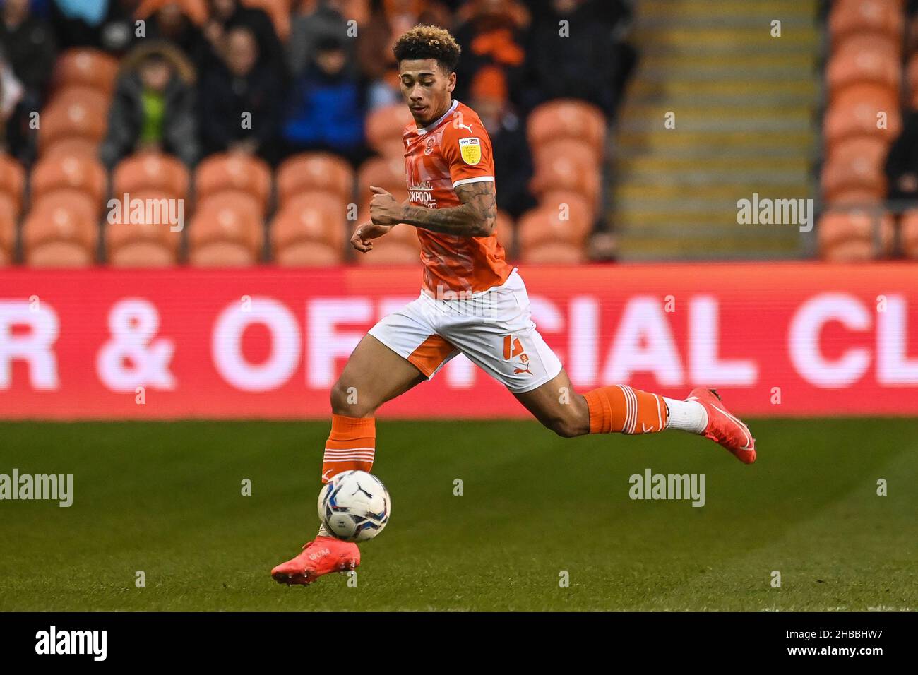Jordan Lawrence-Gabriel #4 of Blackpool makes a break with the ball ...