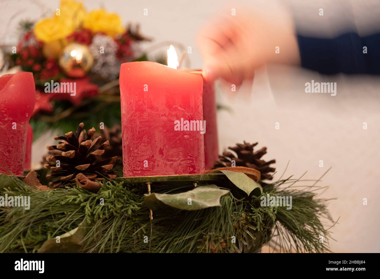 Child hand lights candle Stock Photo - Alamy
