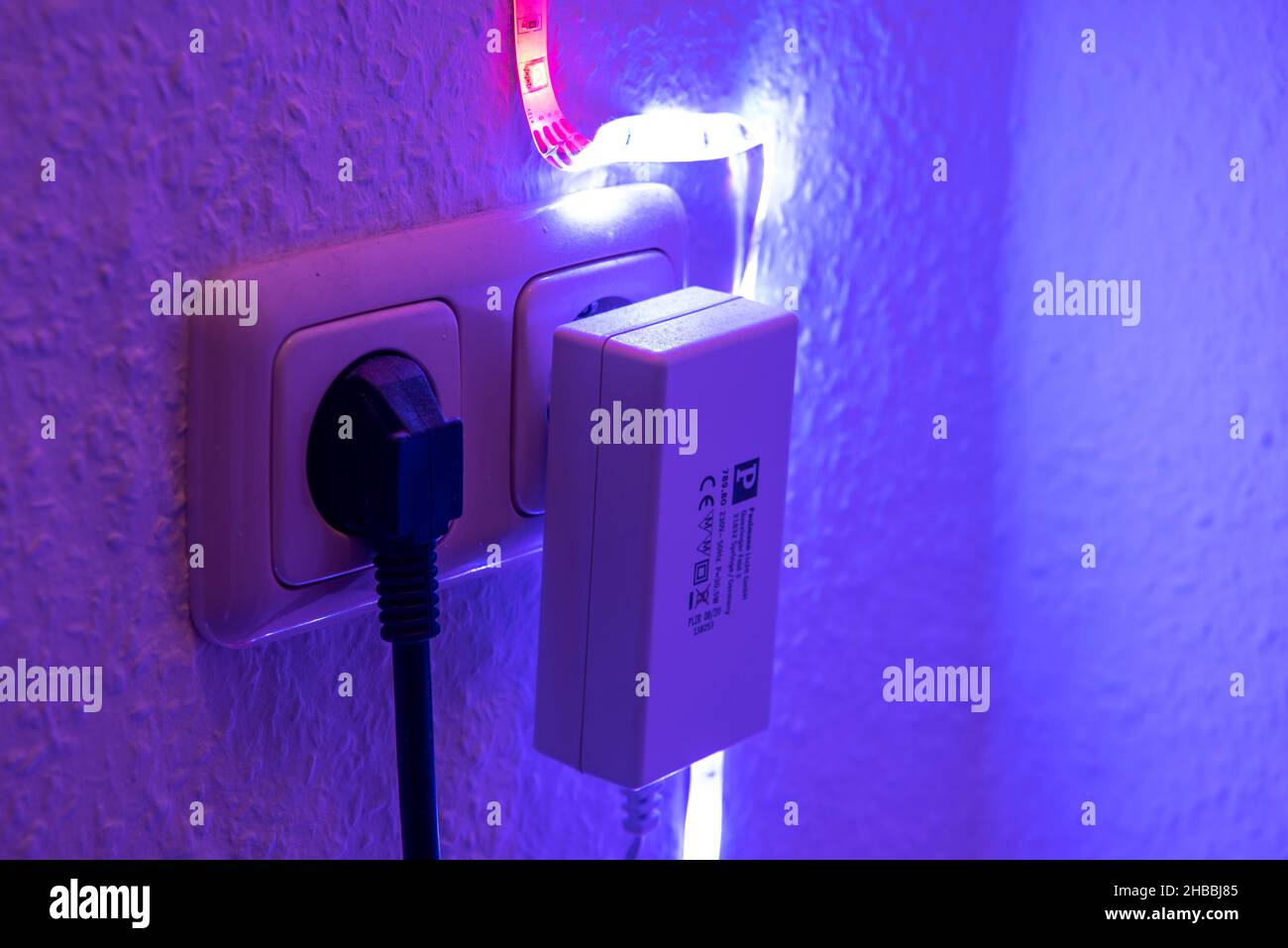 Two occupied sockets in a room Stock Photo - Alamy