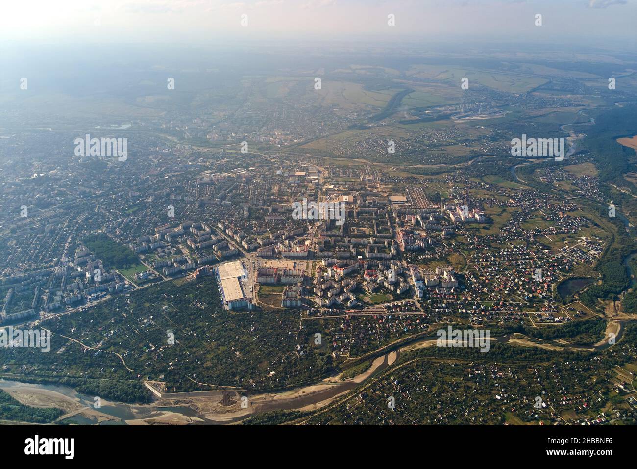 Aerial view from airplane window at high altitude of earth covered with ...