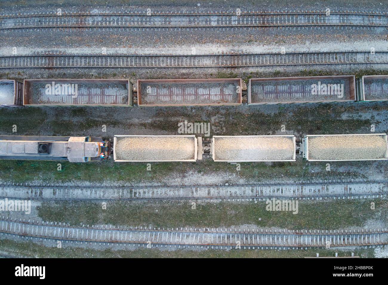 Aerial view of cargo train loaded with crushed stone materials at ...