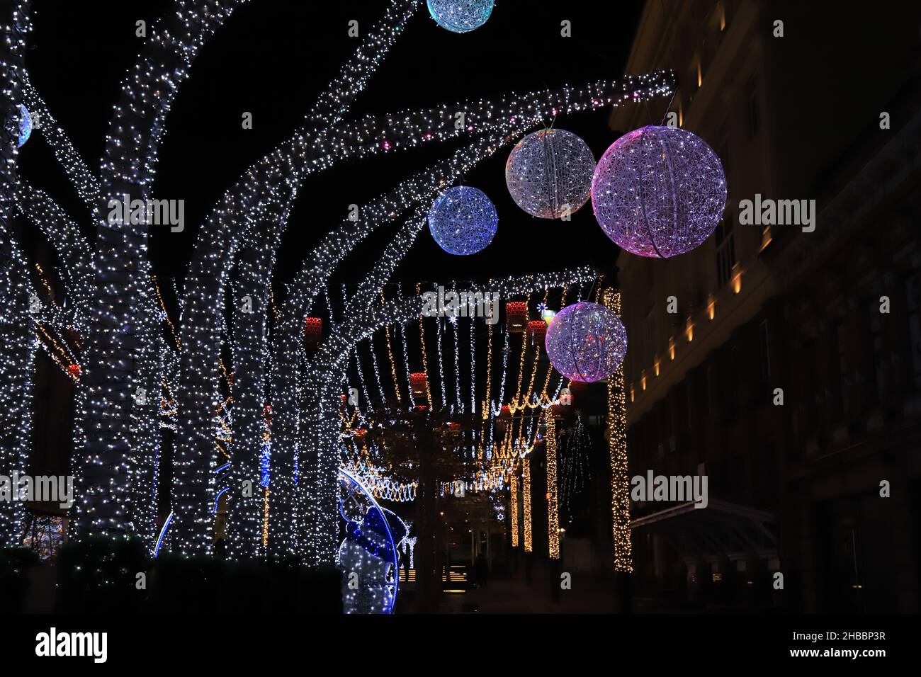 Decorative LED ball shaped lamps illuminate the street at night ...