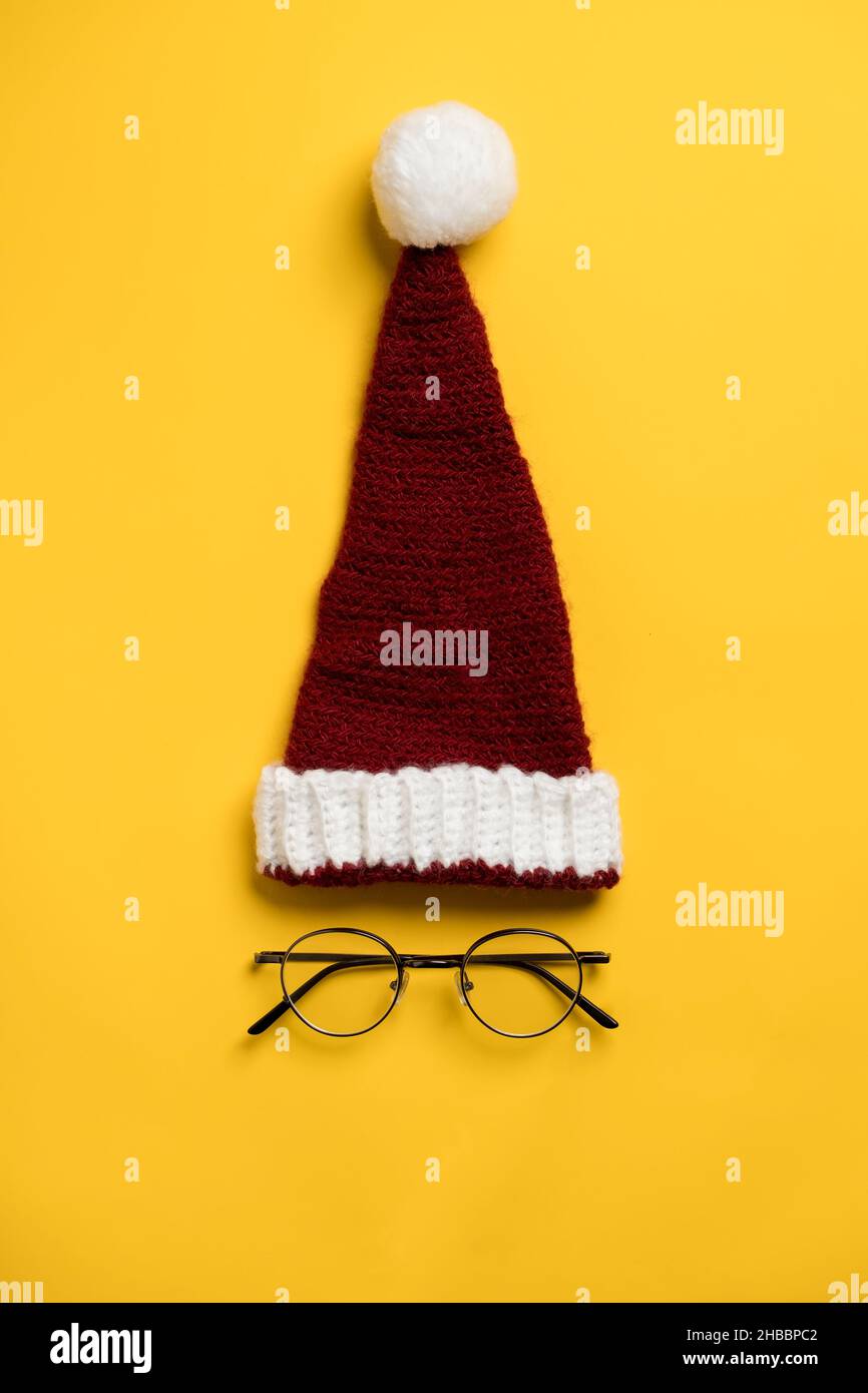 Santa Claus hat and the round glasses underneath it looks like a face ...