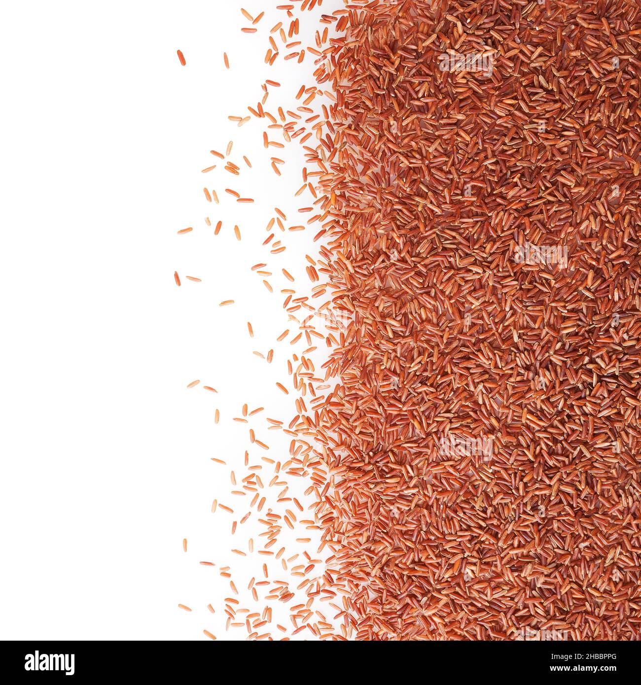 Uncooked red rice on white background with copy space Stock Photo - Alamy