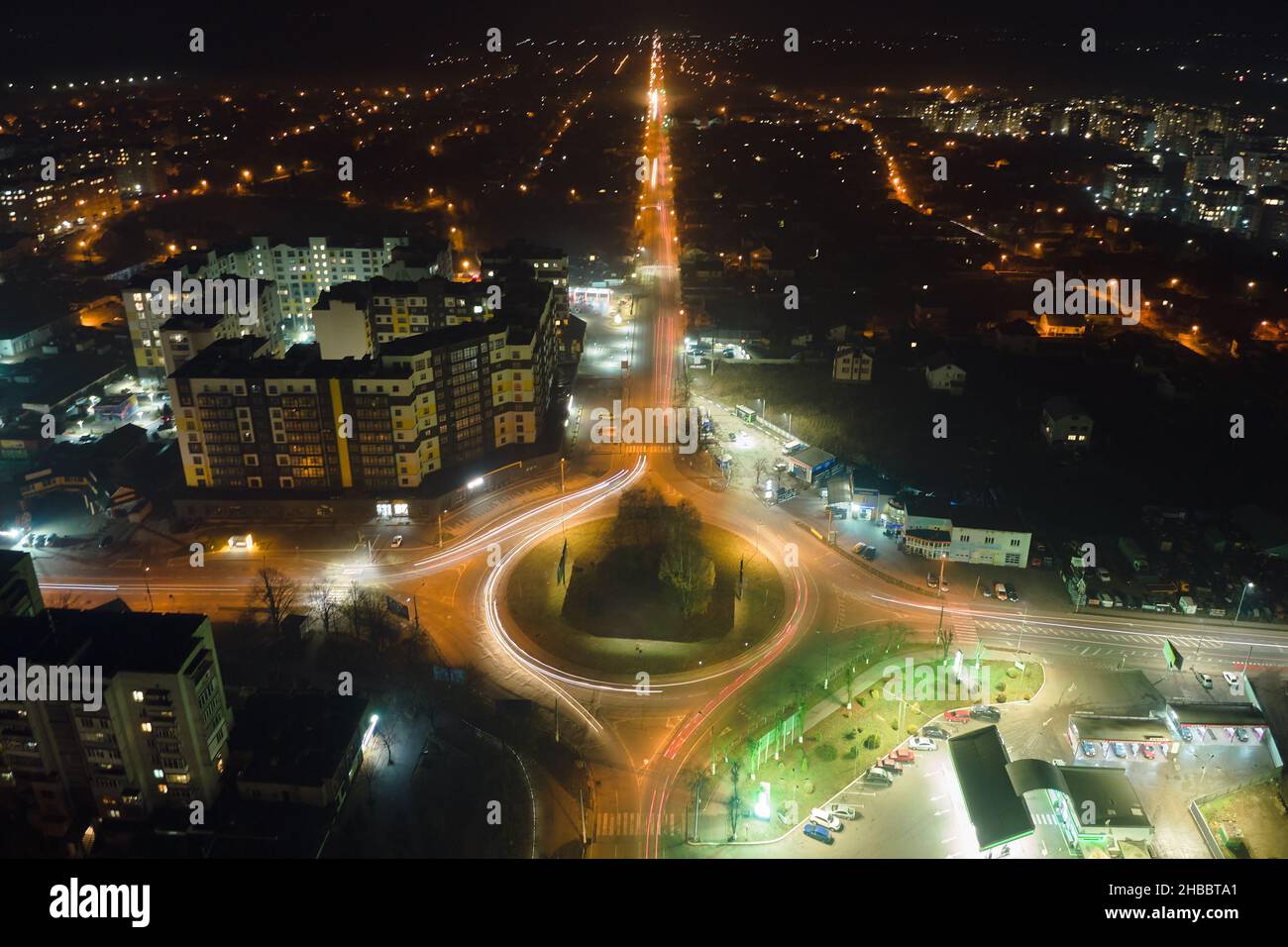 Aerial view of high rise apartment buildings and bright illuminated ...