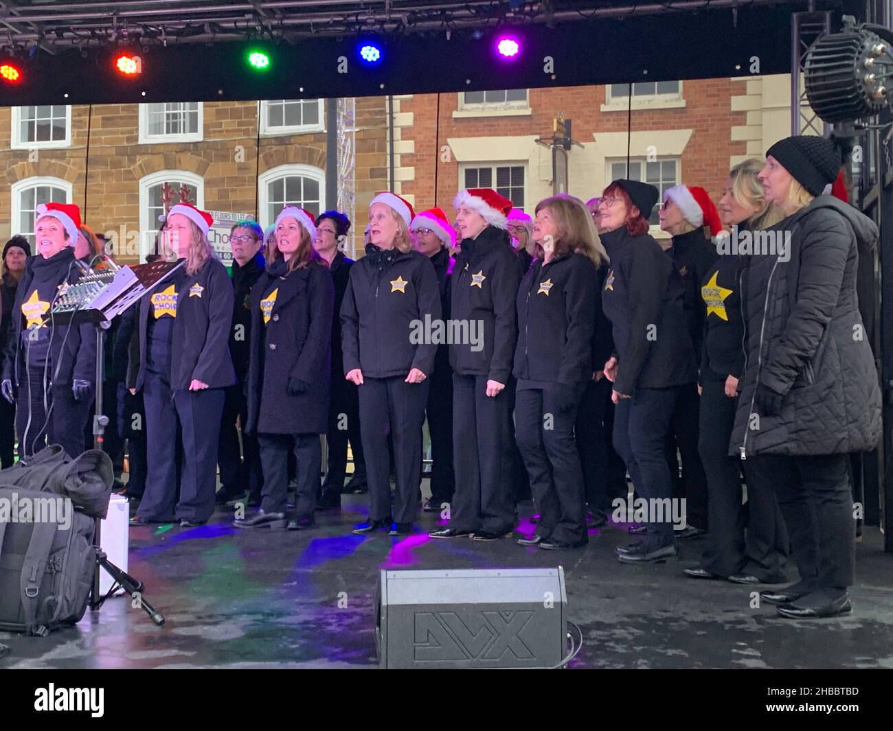 Market Square Northampton UK Rock Choir singers sing songs Christmas ...
