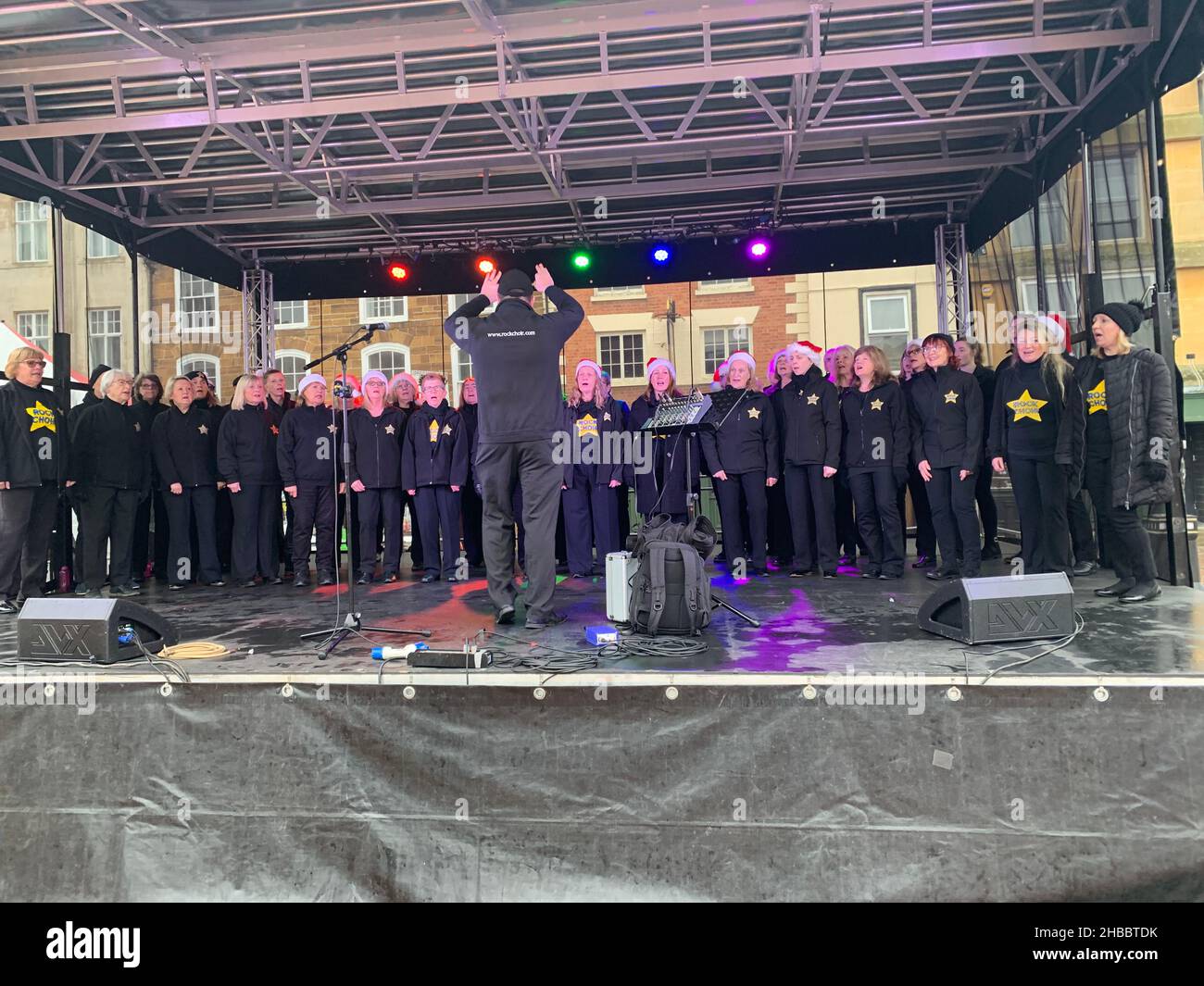Market Square Northampton UK Rock Choir watch play conduct singing ...