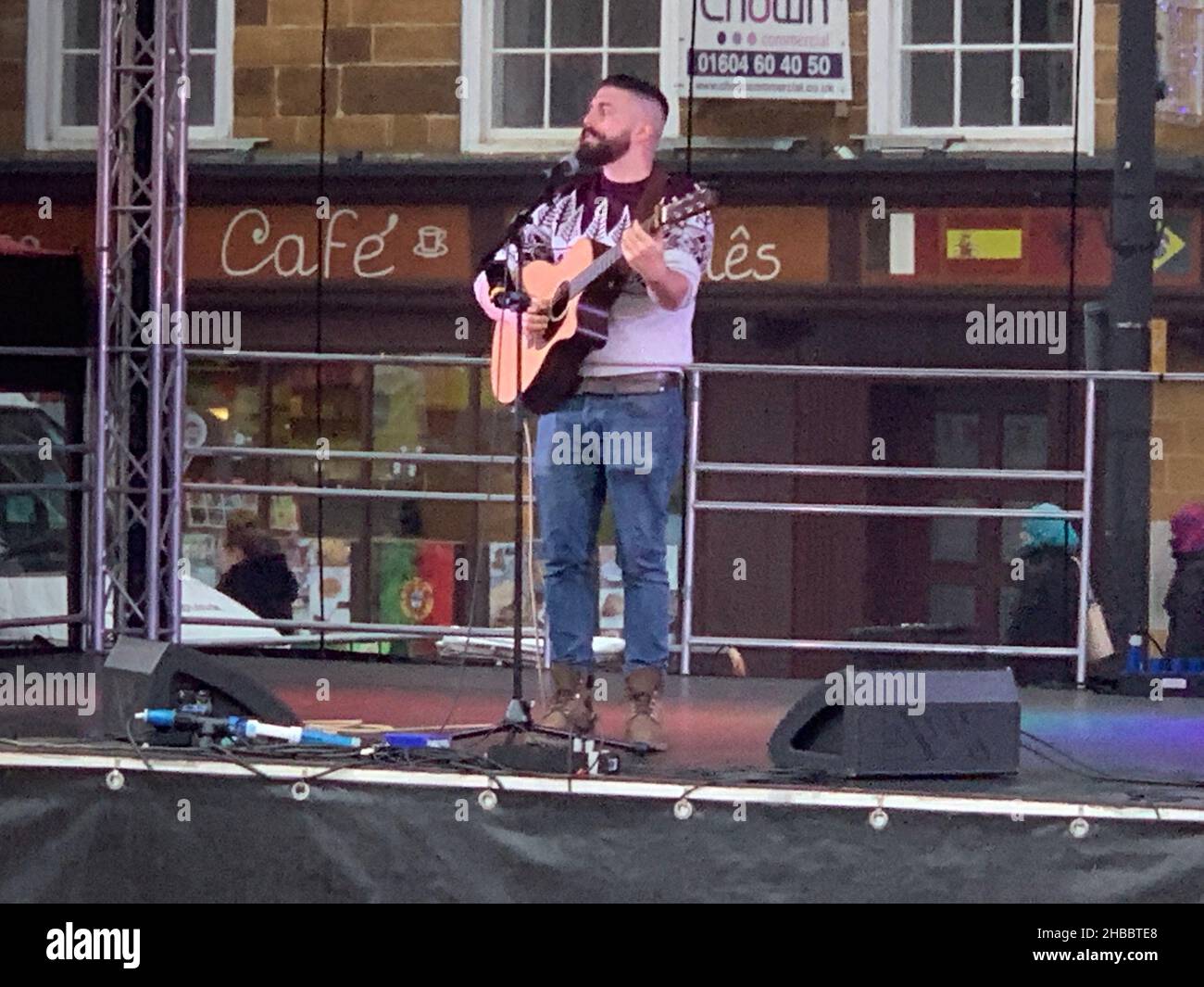 Singer with a guitar on the Market Square Northampton UK singing ...