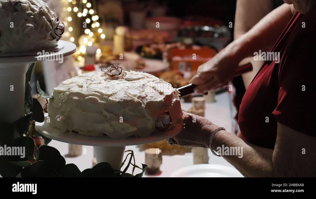 Womans hand cutting cake hi-res stock photography and images - Alamy