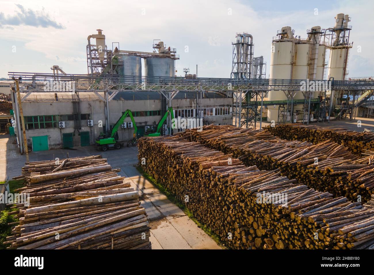 Aerial view of wood processing factory with stacks of lumber at plant ...