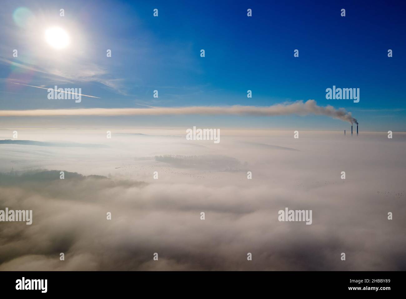 Aerial view of winter landscape with foggy countryside and distant ...