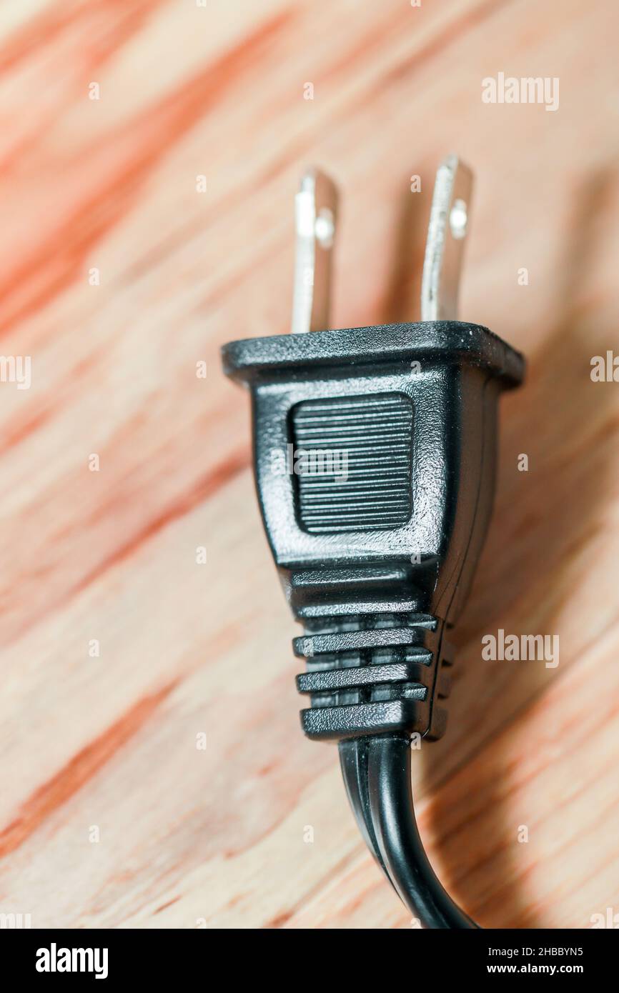 Power supply Electricity plug on brown wooden closeup - Image Stock ...