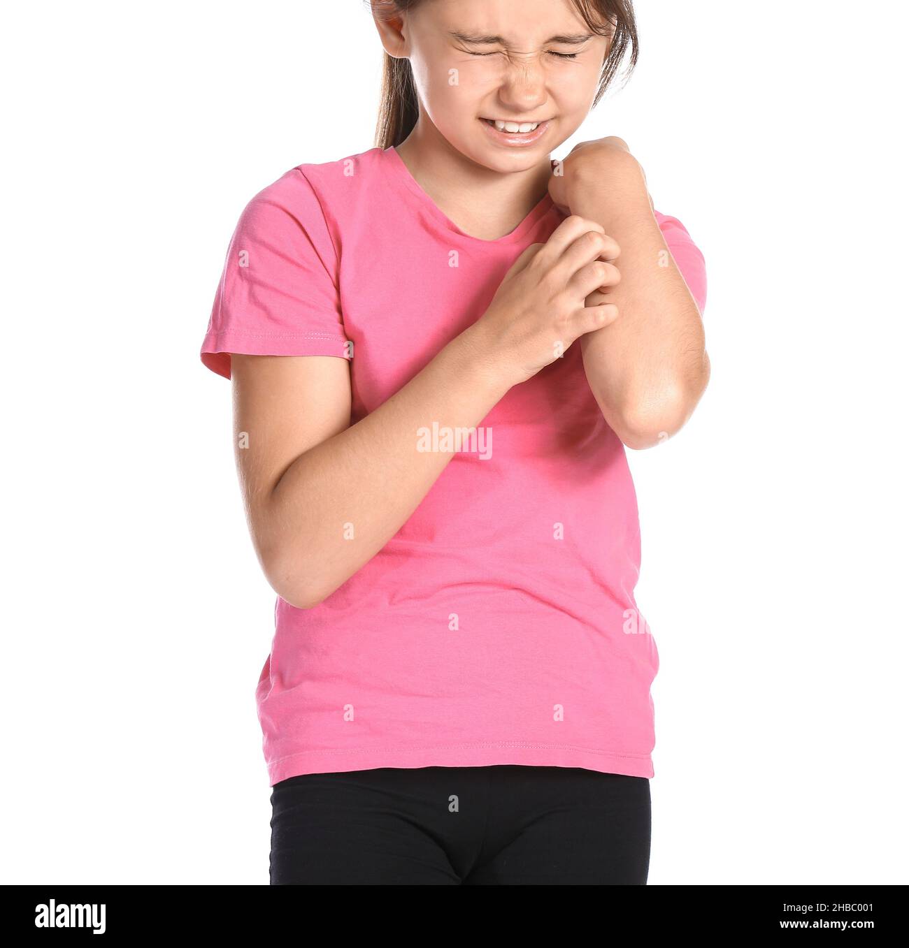Little girl scratching herself on white background Stock Photo - Alamy