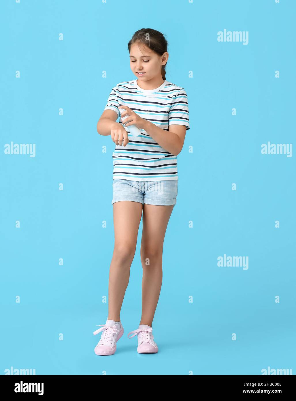 Little girl with mosquito repellent on color background Stock Photo - Alamy