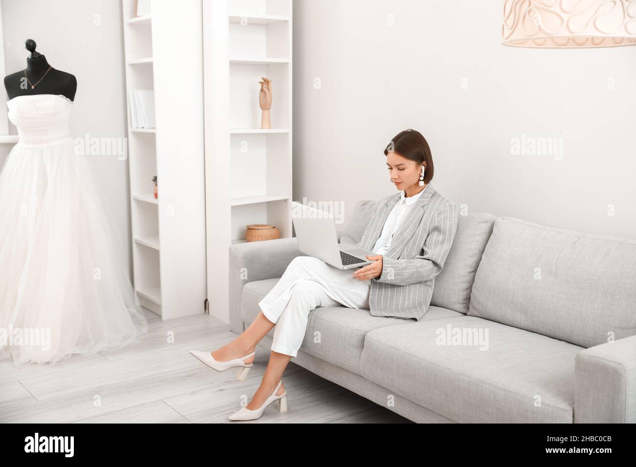 Female wedding planner working in office Stock Photo - Alamy