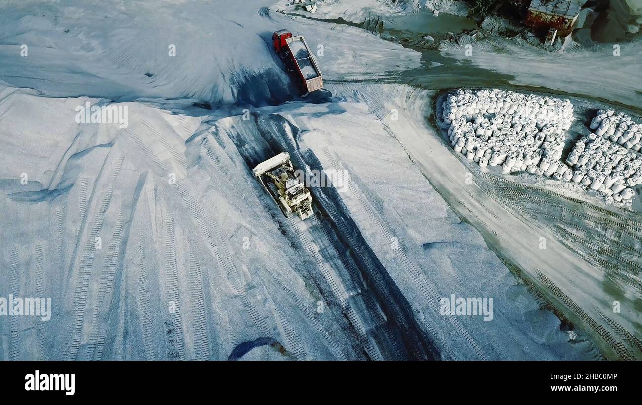 Large quarry and work of heavy mining machinery and equipment. Aerial ...