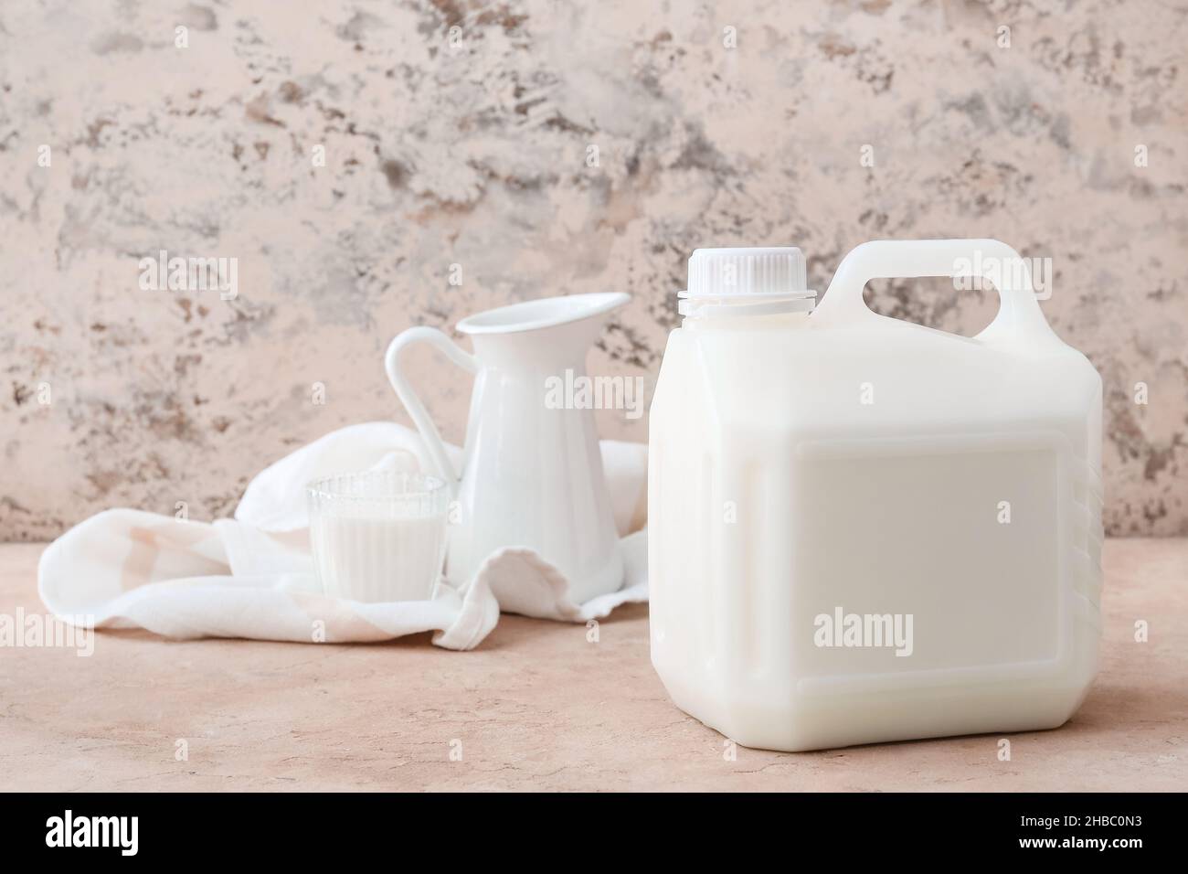 Gallon bottle of milk on table Stock Photo - Alamy